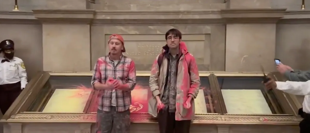 Video Shows Climate Protesters Throwing Pink Powder On Case Holding US ...