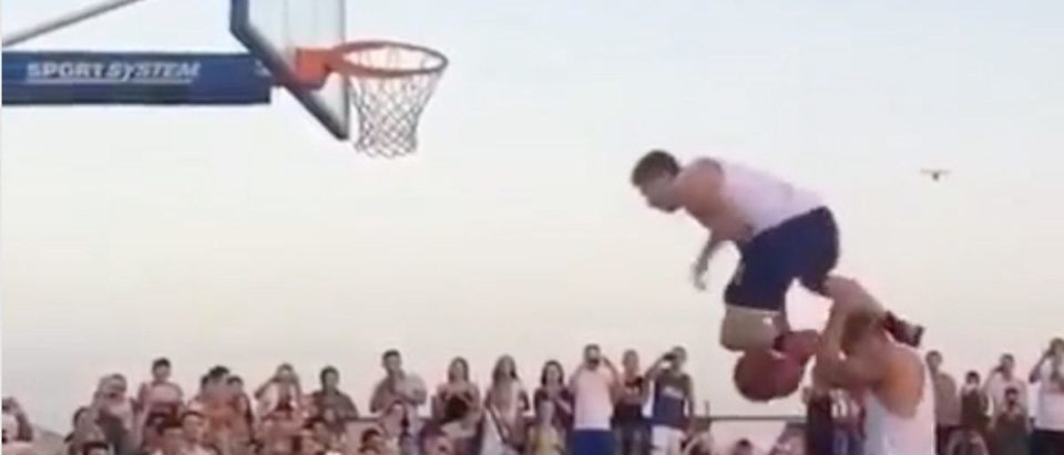 Man Fails Spectacularly When Trying To Dunk Over A Car | The Daily Caller
